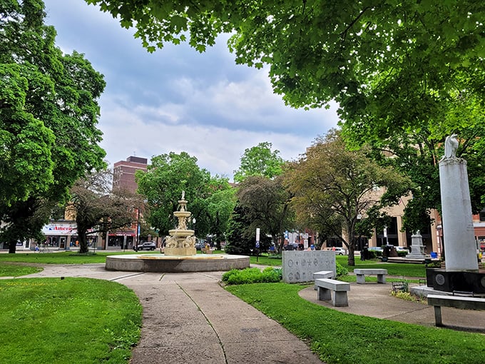 This tranquil park oasis offers a moment of green serenity amid the urban landscape – nature's gentle counterpoint to the city's industrial rhythm.