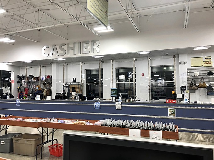 At the checkout counter, treasures transform from store inventory to personal possessions—the final step in the thrifting adventure.