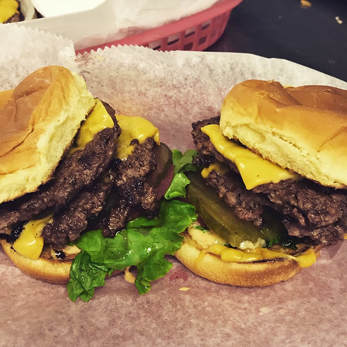 These aren't just cheeseburgers – they're happiness on a bun, where melted American cheese, crisp lettuce and juicy beef create a symphony of comfort.
