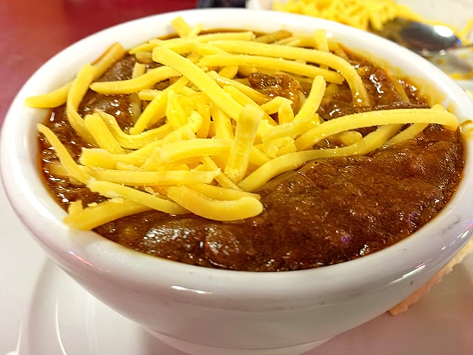 This isn't just chili with cheese—it's a bowl of comfort that's been perfected over decades, no food stylist required.