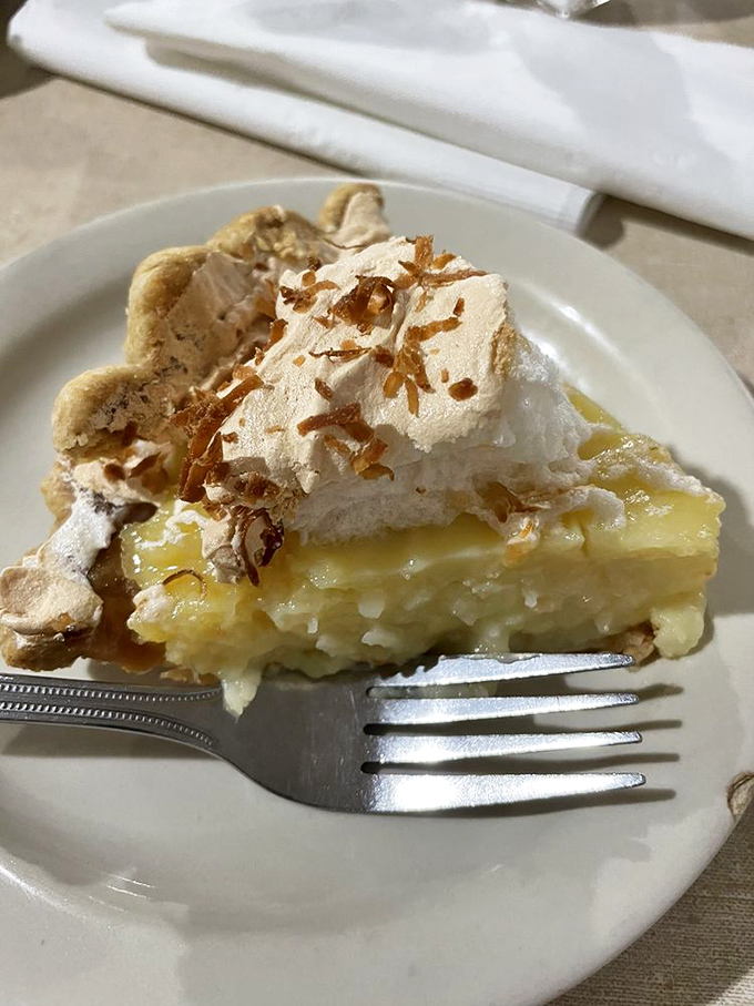 Coconut cream pie that would make tropical islands jealous—a perfect symphony of textures topped with toasted coconut confetti.