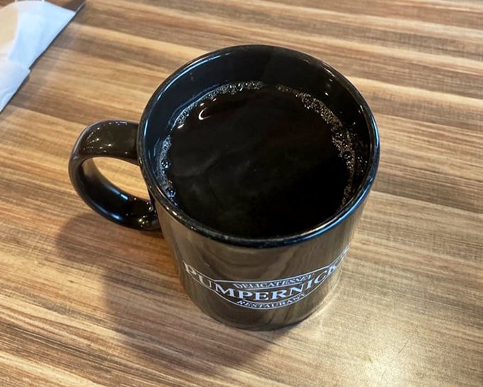 That black coffee mug – the unsung hero of every deli experience, ready to wash down your sandwich and prepare you for dessert considerations.