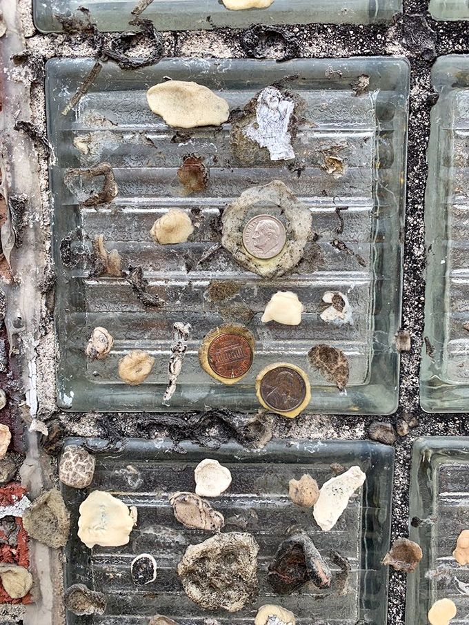The famous "gum wall" – where patrons leave their mark and a penny for good luck in this quirky tradition that health inspectors somehow tolerate.