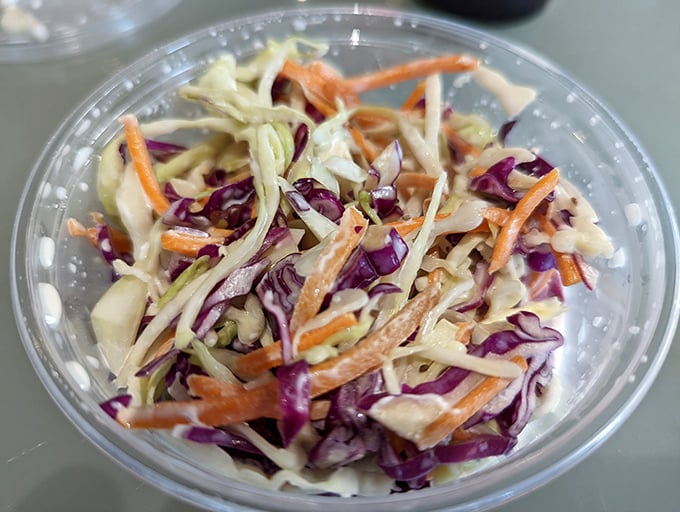 Coleslaw that actually deserves table space – crisp, colorful, and far from the soggy afterthought served at lesser establishments.