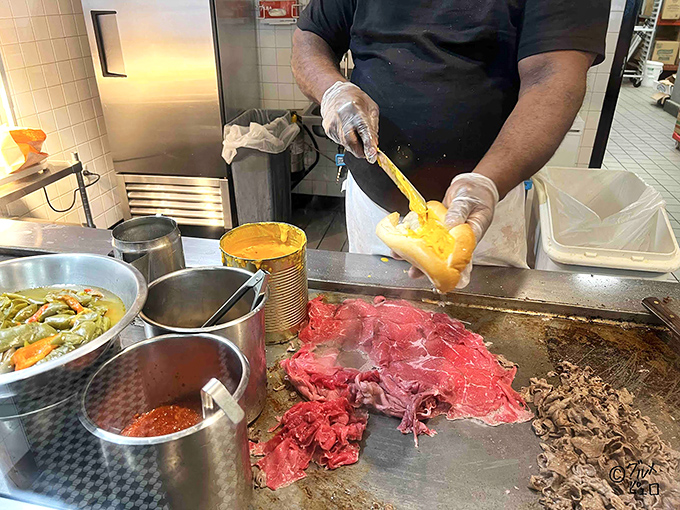 The sacred ritual of cheese application – that crucial moment when sandwich construction becomes sandwich art. Pure culinary theater.