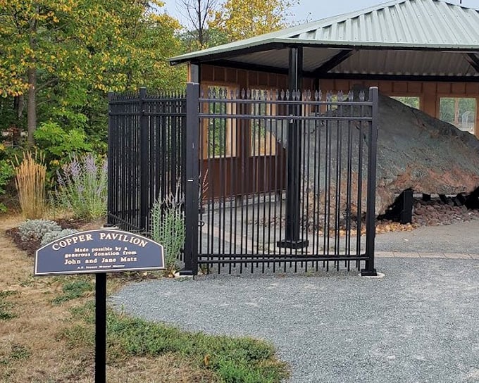 The Copper Pavilion showcases Michigan's mineral heritage in an outdoor setting, where massive specimens bask in natural light.