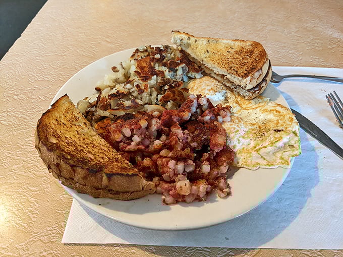 Corned beef hash with eggs isn't just breakfast—it's a beautiful mosaic of textures where crispy meets creamy and yesterday's brisket finds tomorrow's purpose.