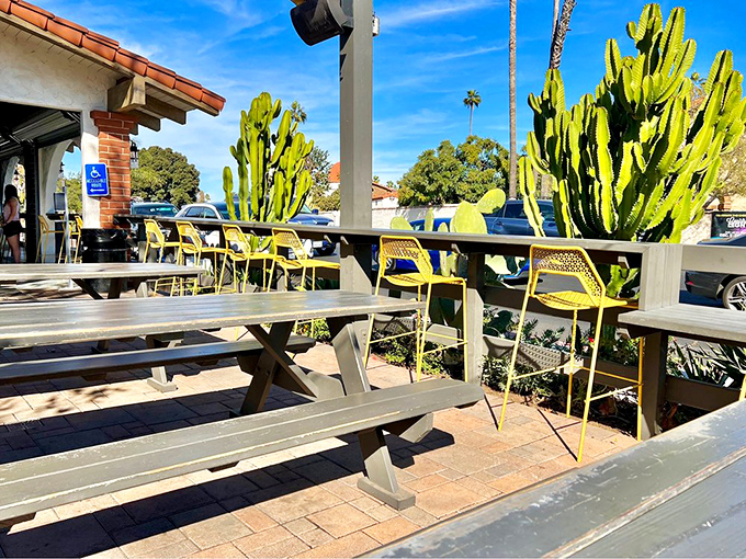 Yellow chairs and picnic tables under California skies—the perfect setting for your impending food coma.