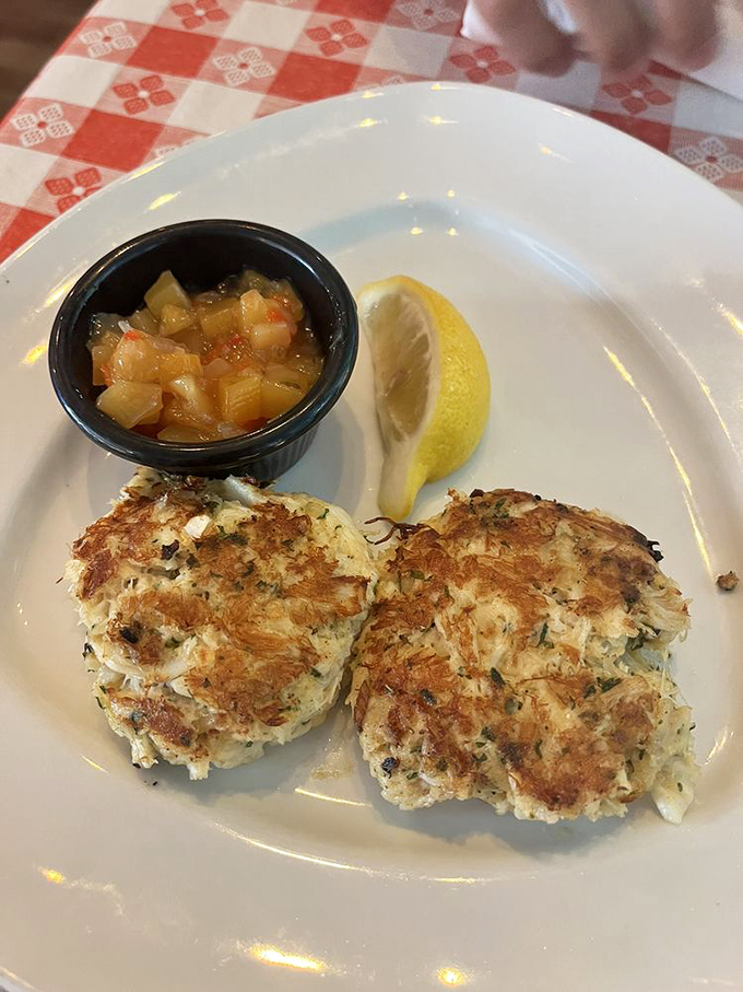 Golden-brown crab cakes with just enough binding to keep the sweet meat together—like a good marriage, it's all about commitment without smothering.