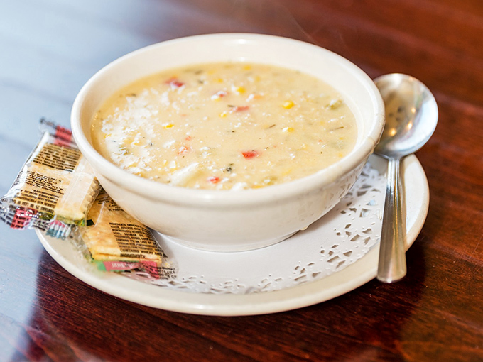 A bowl of creamy chicken corn soup that looks like Pennsylvania comfort in liquid form—the kind that makes rainy days worth celebrating.