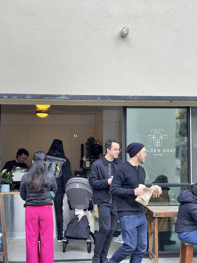 The weekend crowd at Golden Goat includes everyone from young families to neighborhood regulars—a microcosm of San Francisco's diverse coffee culture.