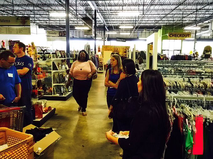 The social aspect of thrifting in action – strangers united by the universal language of "Can you believe someone got rid of this?"