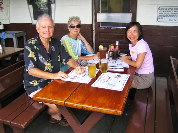 Happy diners enjoying the simple pleasure of great food and cold drinks. This is what vacation memories are made of.