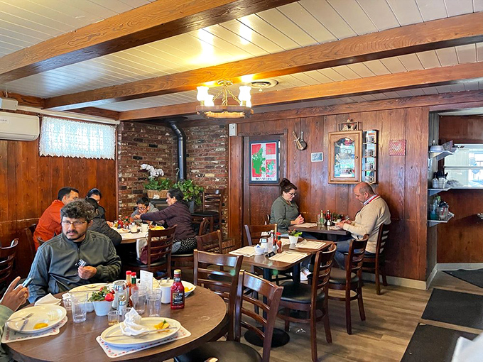 Morning conversations and coffee refills flow freely in this wood-paneled sanctuary where breakfast isn't just a meal—it's a cherished ritual.