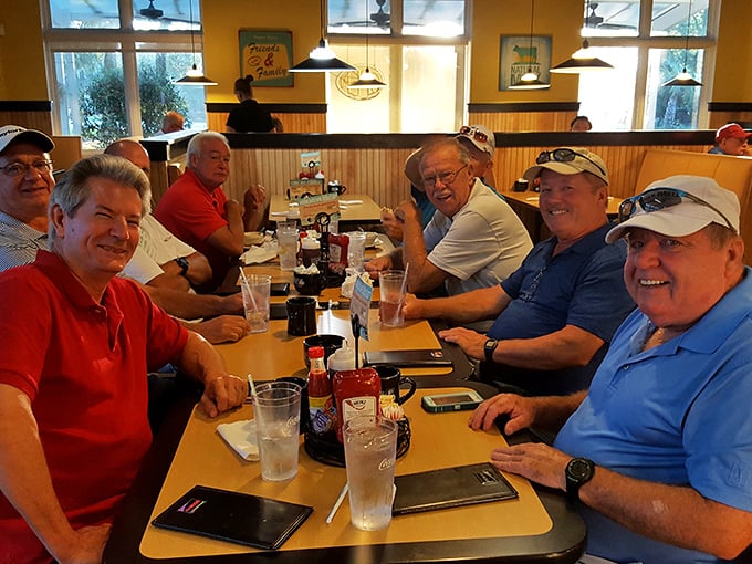 A table of regulars sharing stories over coffee and eggs—the true heart of any great breakfast spot. These gentlemen clearly know where to find the good stuff.