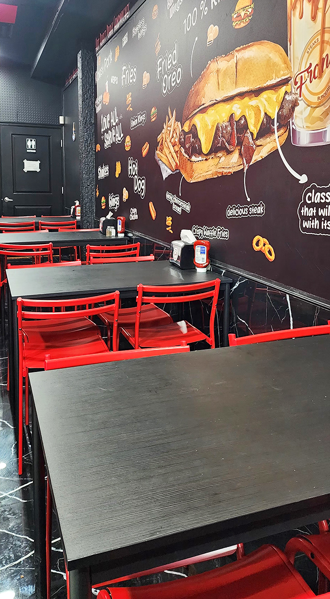 Red chairs invite you to sit and contemplate the mural of sandwich perfection – a dining room that knows its priorities.