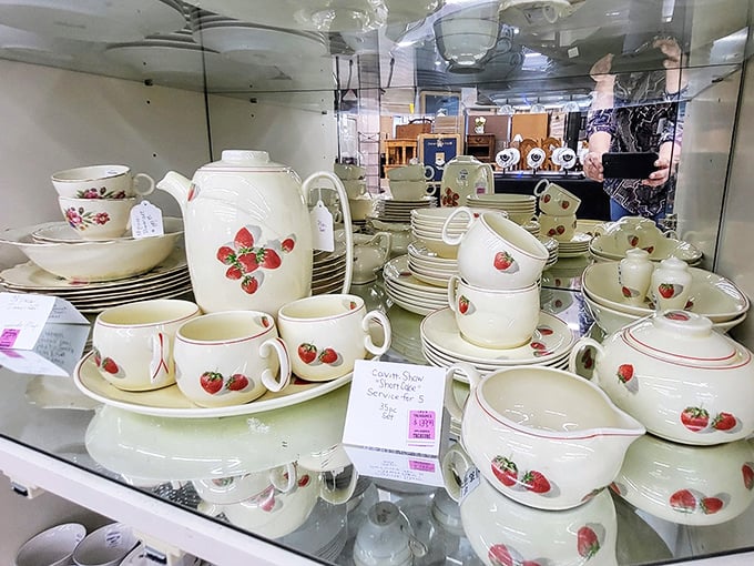 Vintage dinnerware sets wait patiently for new homes—this strawberry pattern practically begs to host your next summer brunch.