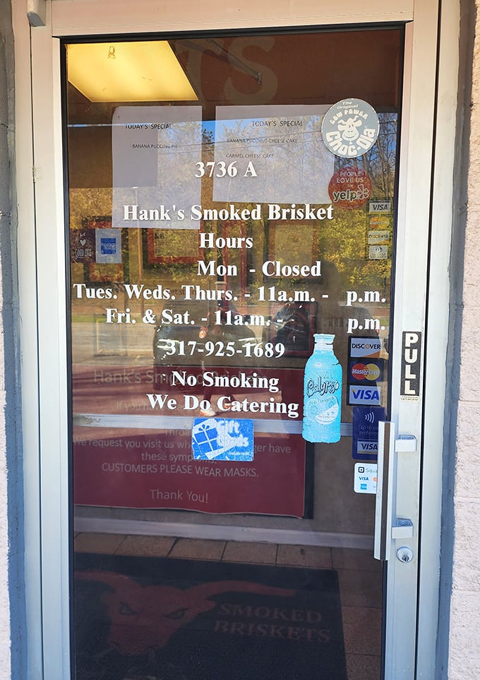 The door that lists the hours – crucial information for planning your week around barbecue availability, as any sensible person would.