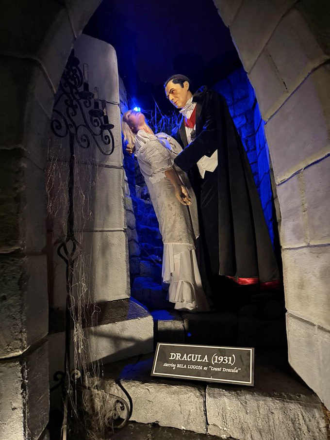 Dracula embraces his victim in this dramatic scene. The blue lighting adds atmosphere, though he's probably thinking about Texas BBQ instead of blood.