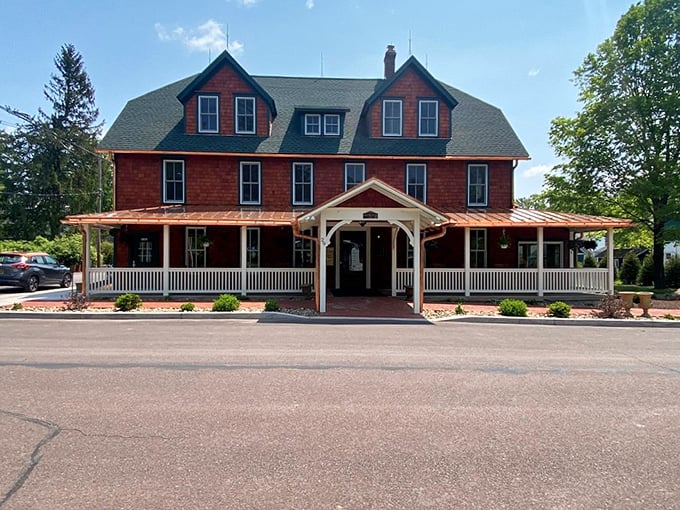 The Eagles Mere Inn welcomes visitors with its wraparound porch and classic red clapboard exterior – a Norman Rockwell painting brought to three-dimensional life.