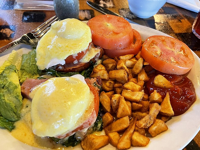 Eggs Benedict reimagined with a Southwestern twist—where hollandaise meets home fries in a breakfast romance for the ages.