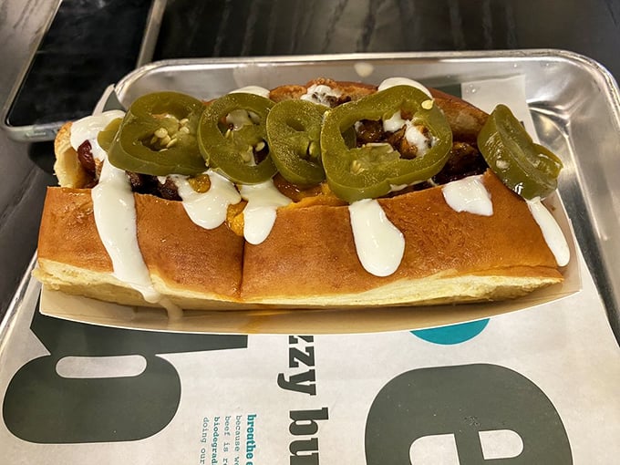 The Enchilada Dog proves that sometimes the best ideas come from cross-cultural culinary matchmaking—spicy, creamy, and utterly addictive.