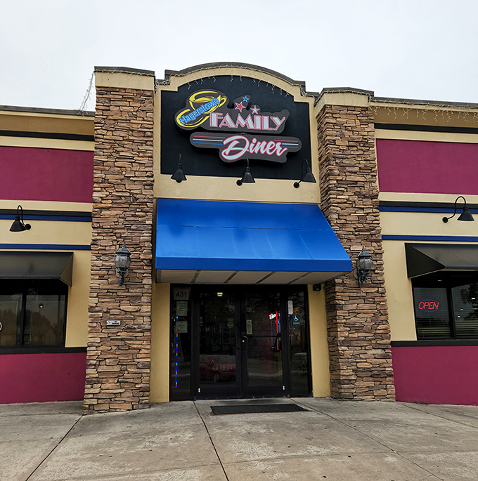 The entrance beckons with its distinctive blue awning and stone columns—a landmark that says "comfort food ahead" to hungry travelers.