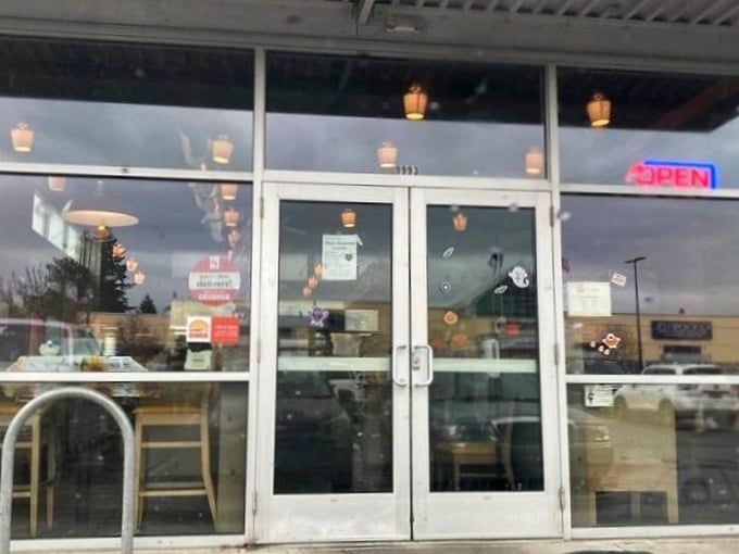 The entrance to happiness is often unassuming—just a glass door with an "OPEN" sign promising all will be well inside.