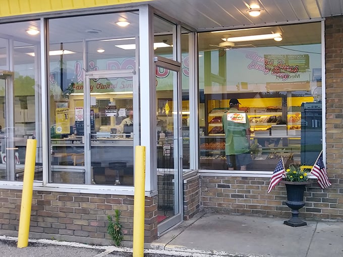 The entrance to paradise isn't pearly gates—it's glass doors with American flags flanking the path to fried dough nirvana.