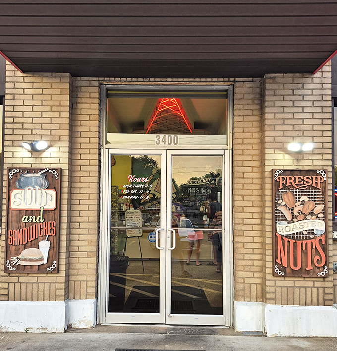 "Soup and Sandwiches" on one side, "Fresh Roasted Nuts" on the other—this entrance promises everything a hungry traveler could desire.