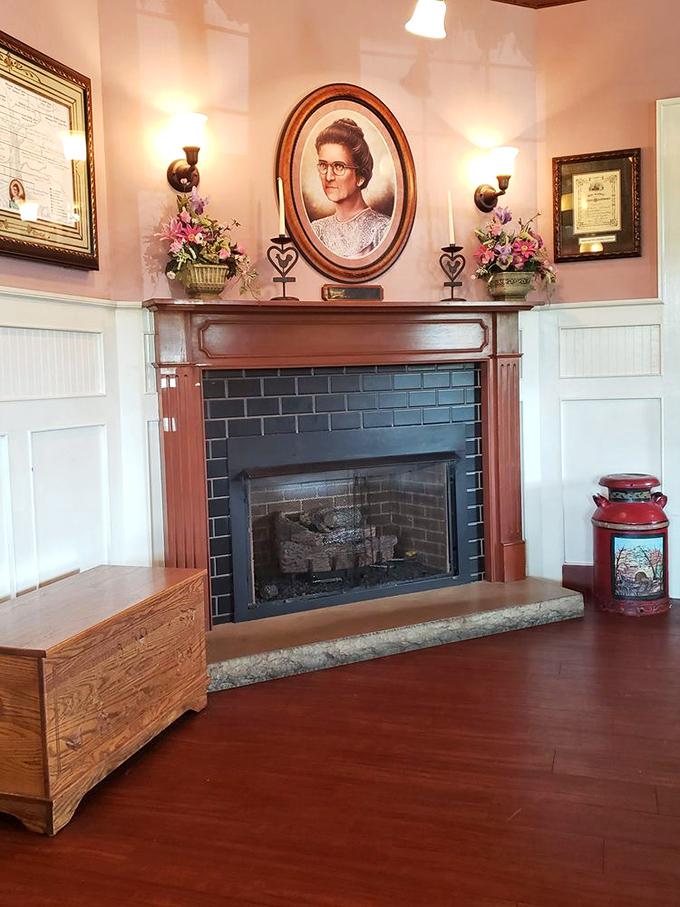 The fireplace with its portrait centerpiece isn't just decoration—it's a shrine to the Southern tradition of gathering around good food. 