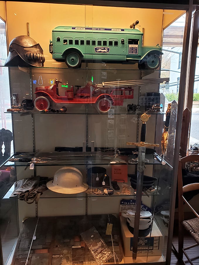 Heroes in miniature—vintage toy emergency vehicles stand ready for imaginary rescues. That green bus probably has stories from every stop.