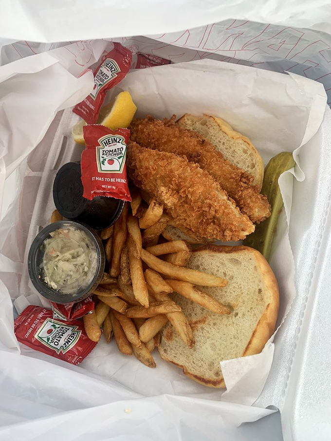 The fish sandwich basket—complete with the universal signal of quality: a pickle spear standing at attention.