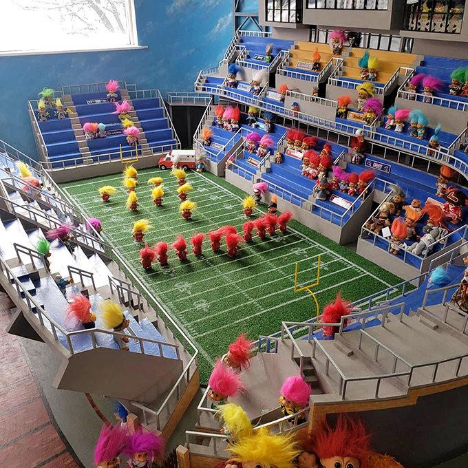 Troll Football Stadium – where tiny competitors with gravity-defying hair battle it out on the gridiron. The team colors? Every color imaginable.