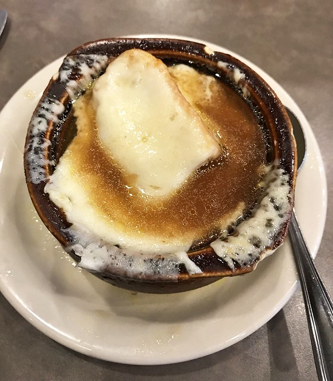 French onion soup that's achieved the impossible trifecta: sweet caramelized onions, rich broth, and cheese so perfectly melted it deserves its own fan club.