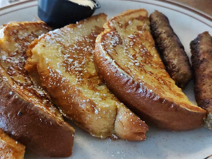 French toast that makes you question why you ever eat anything else for breakfast – golden, crisp, and dusted with powdered sugar.