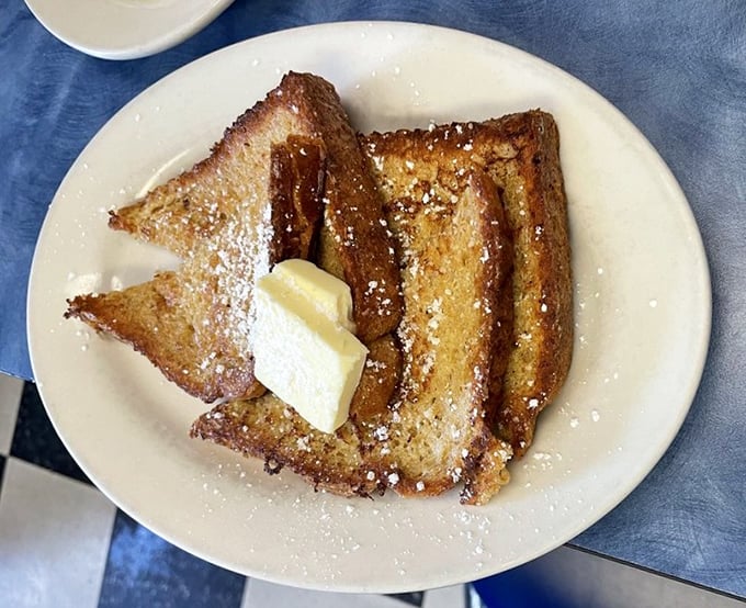 French toast that's been dipped, griddled, and powdered to perfection—the breakfast equivalent of putting on your Sunday best.