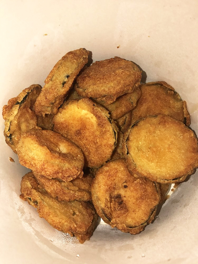 Fried zucchini coins that could make vegetable skeptics reconsider their life choices. Crispy exteriors giving way to tender insides—nature's perfect compromise.