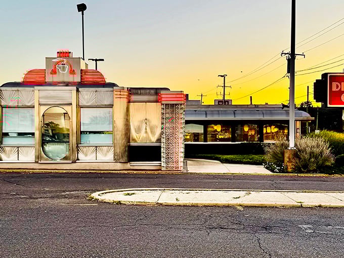 As twilight settles, The Dining Car's windows glow with promise—a landmark that's witnessed first dates, family celebrations, and everyday hunger for decades.