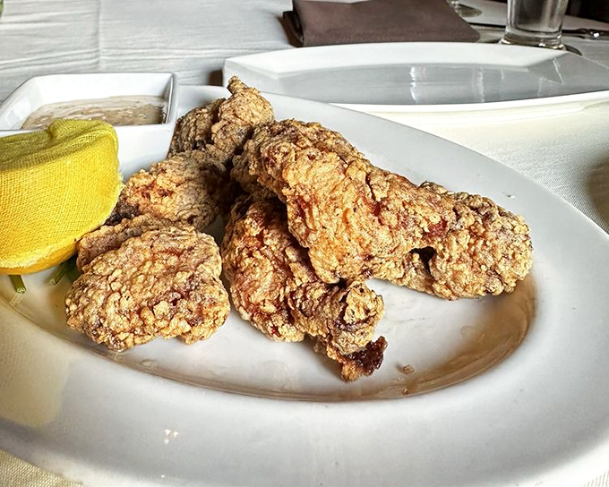 Golden-fried gator bites that turn the intimidating into the irresistible – proving that sometimes the most interesting meals begin with courage.