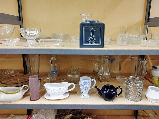 Glassware gathering tells tales of dinner parties past – that Eiffel Tower vase definitely hosted someone's anniversary roses once upon a time.