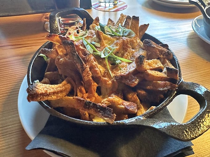 These aren't just fries—they're a declaration of potato love, crispy on the outside, fluffy inside, and baptized in savory gravy with a sprinkle of green onions.