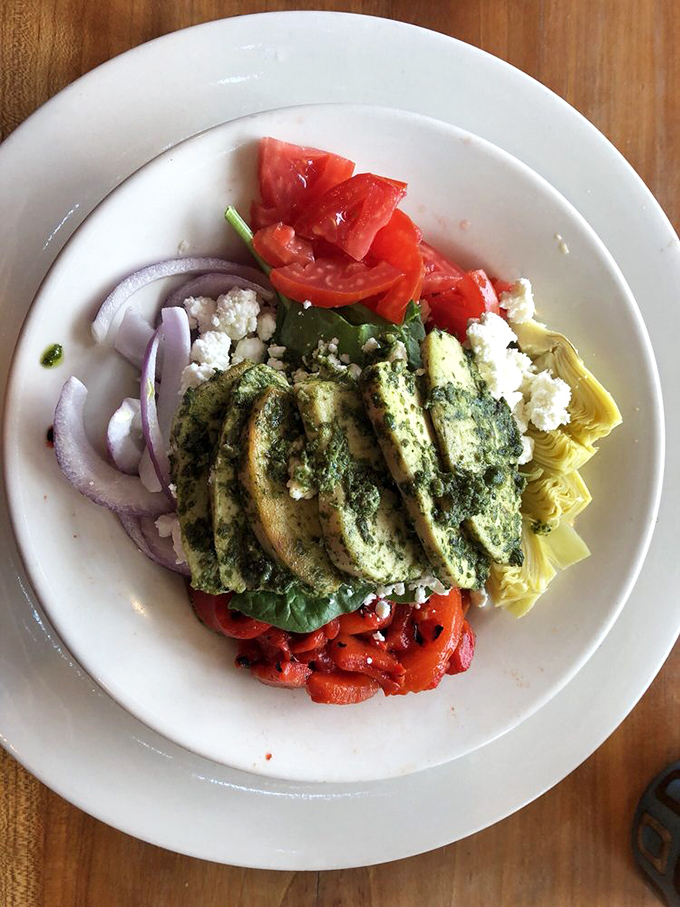 This pesto chicken salad isn't just lunch—it's a Mediterranean vacation for your taste buds, no passport required.