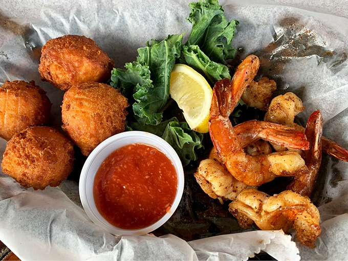 Seafood and hush puppies sharing a basket like old friends at a reunion—crispy, golden, and impossible to eat just one.