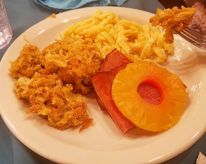 Ham with pineapple rings and mac and cheese—a plate that screams "Midwestern potluck champion" in the most delicious way possible.