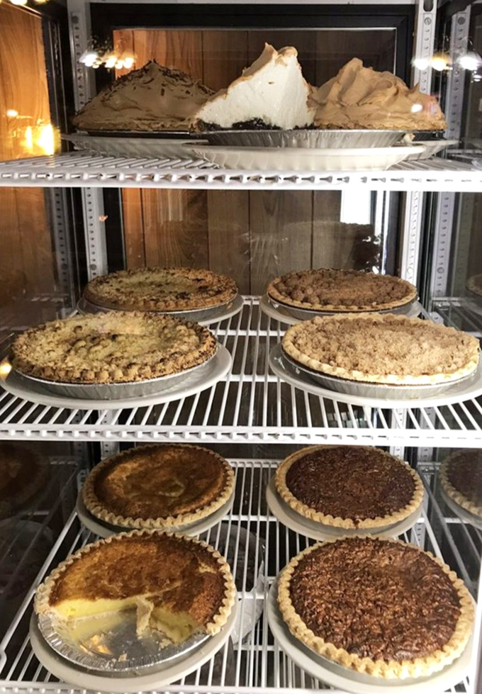 The pie case—where all diet resolutions go to die a delicious death. That mile-high meringue isn't just a topping—it's a fluffy cloud of sweet dreams.