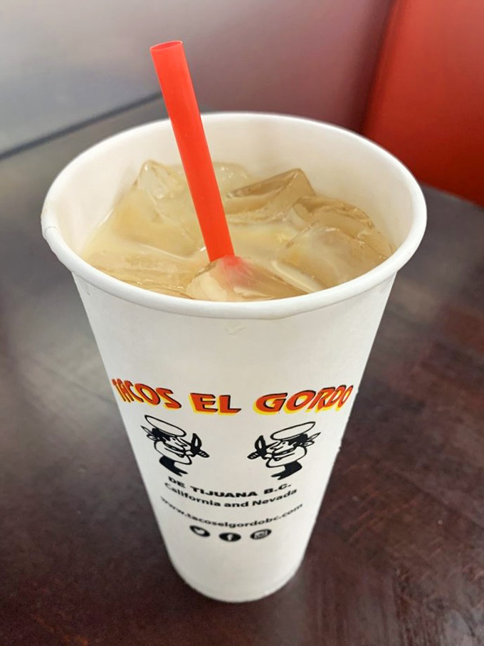 Creamy horchata in branded cup – the perfect cooling companion to spicy taco adventures ahead.
