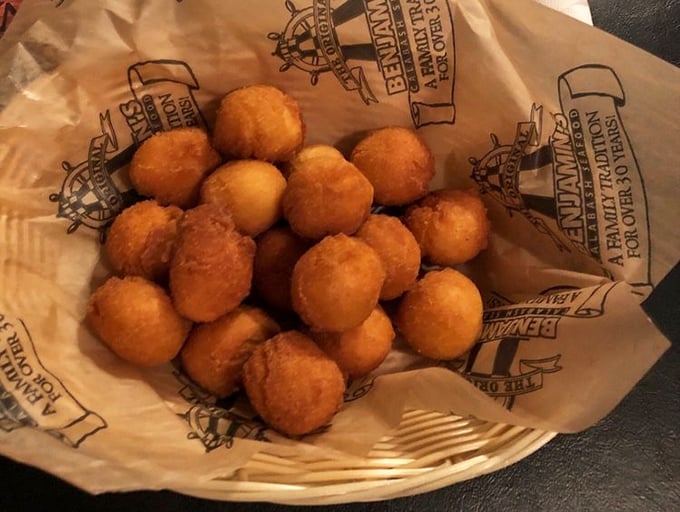 Hushpuppies so good they deserve their own fan club. These golden orbs of cornmeal perfection are what dreams—and expanded waistlines—are made of.