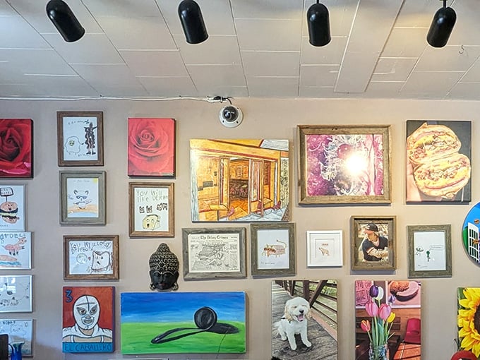 The wall art gallery creates a quirky backdrop for your meal – part deli, part museum, all character.