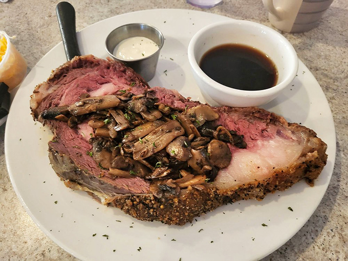 Prime rib crowned with sautéed mushrooms isn't just dinner—it's a celebration of carnivorous pleasures that demands your full attention.